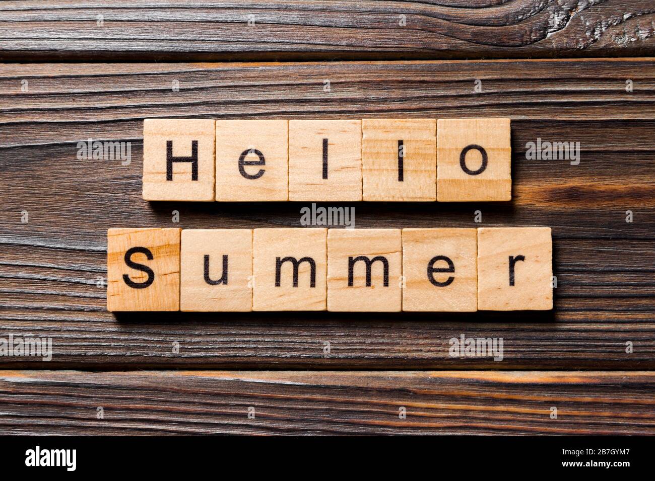 Hello Summer word written on wood block. Hello Summer text on wooden ...