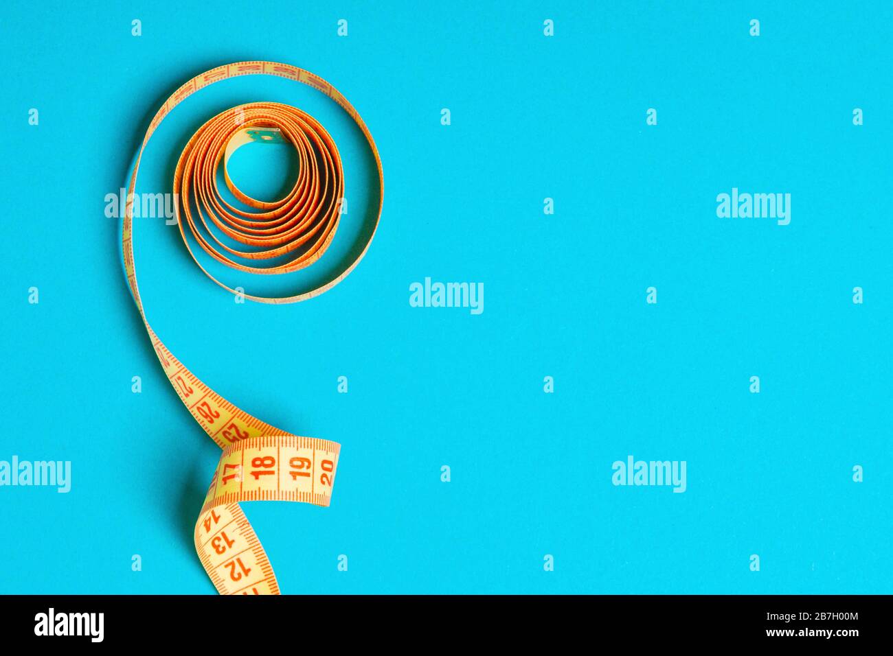 Rolled tape measure with space for your design. Top view of slim waist ...