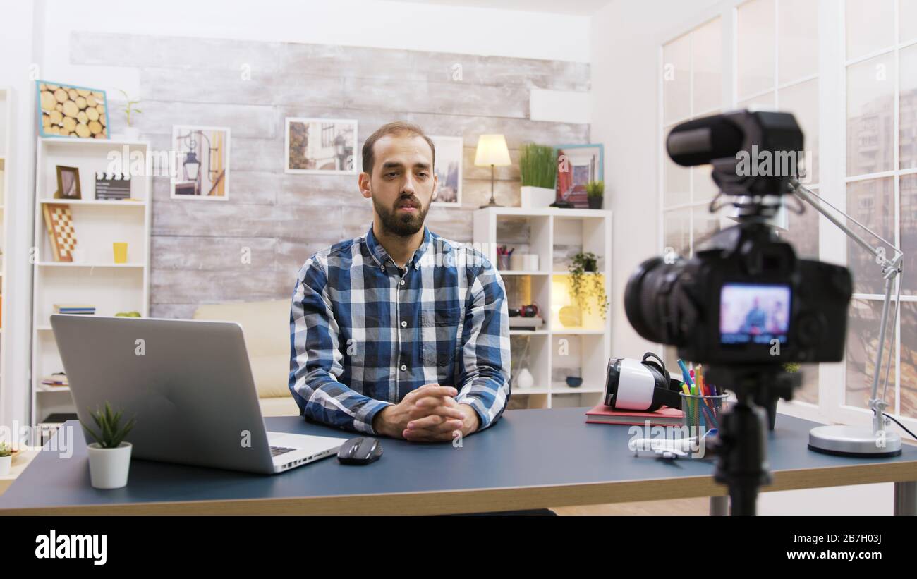 Young vlogger talking with his subscribers on social media. Creative ...