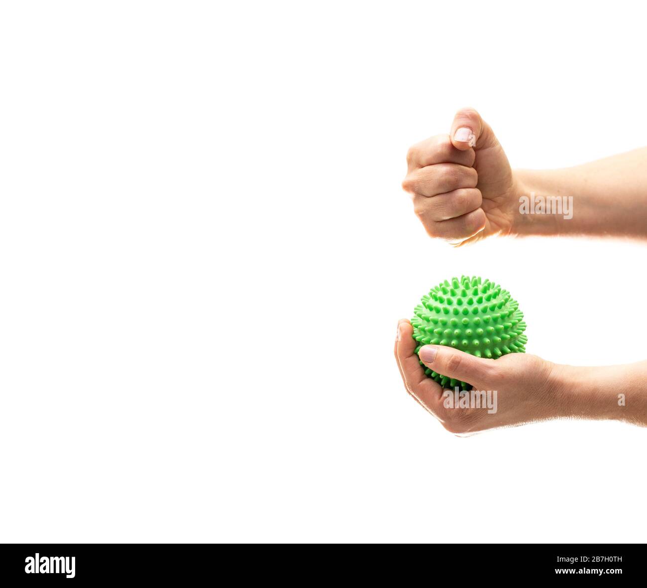 Hand holding sphere with spines while right fist crushes it Stock Photo ...