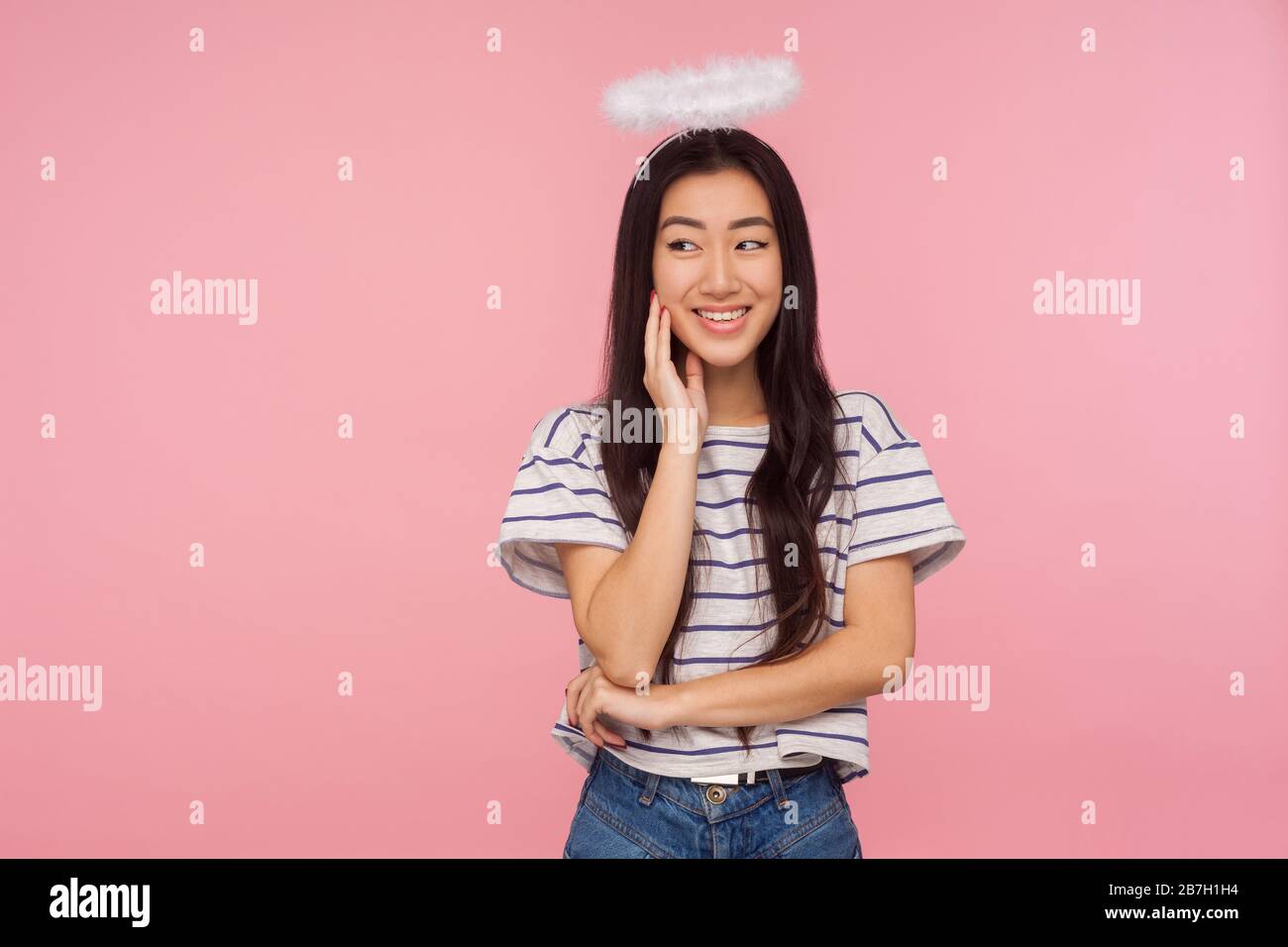 Portrait of lovely angelic asian girl with long brunette hair and halo ...