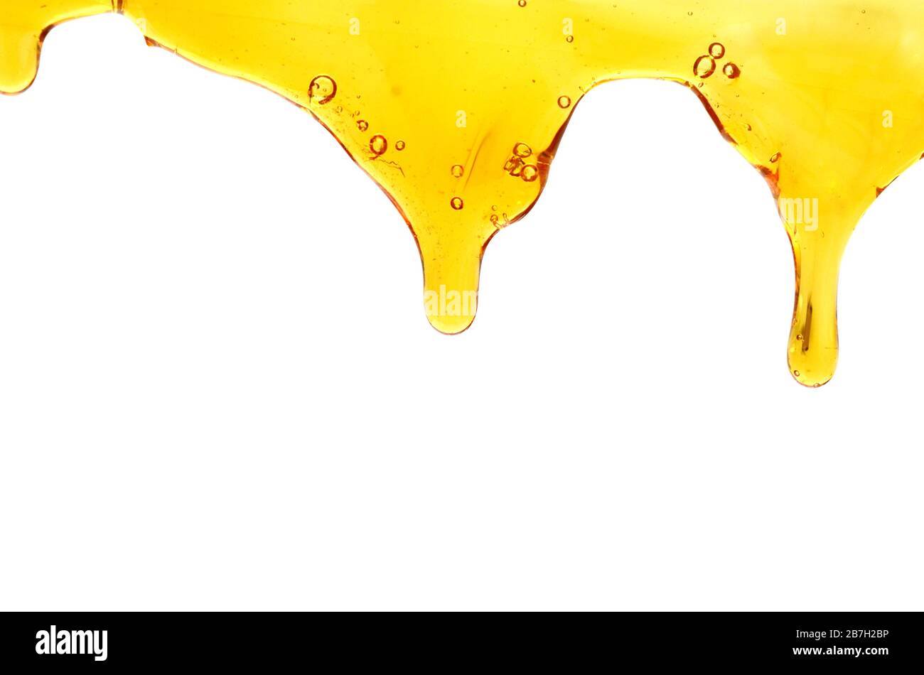 Flow down honey isolated on white Stock Photo - Alamy