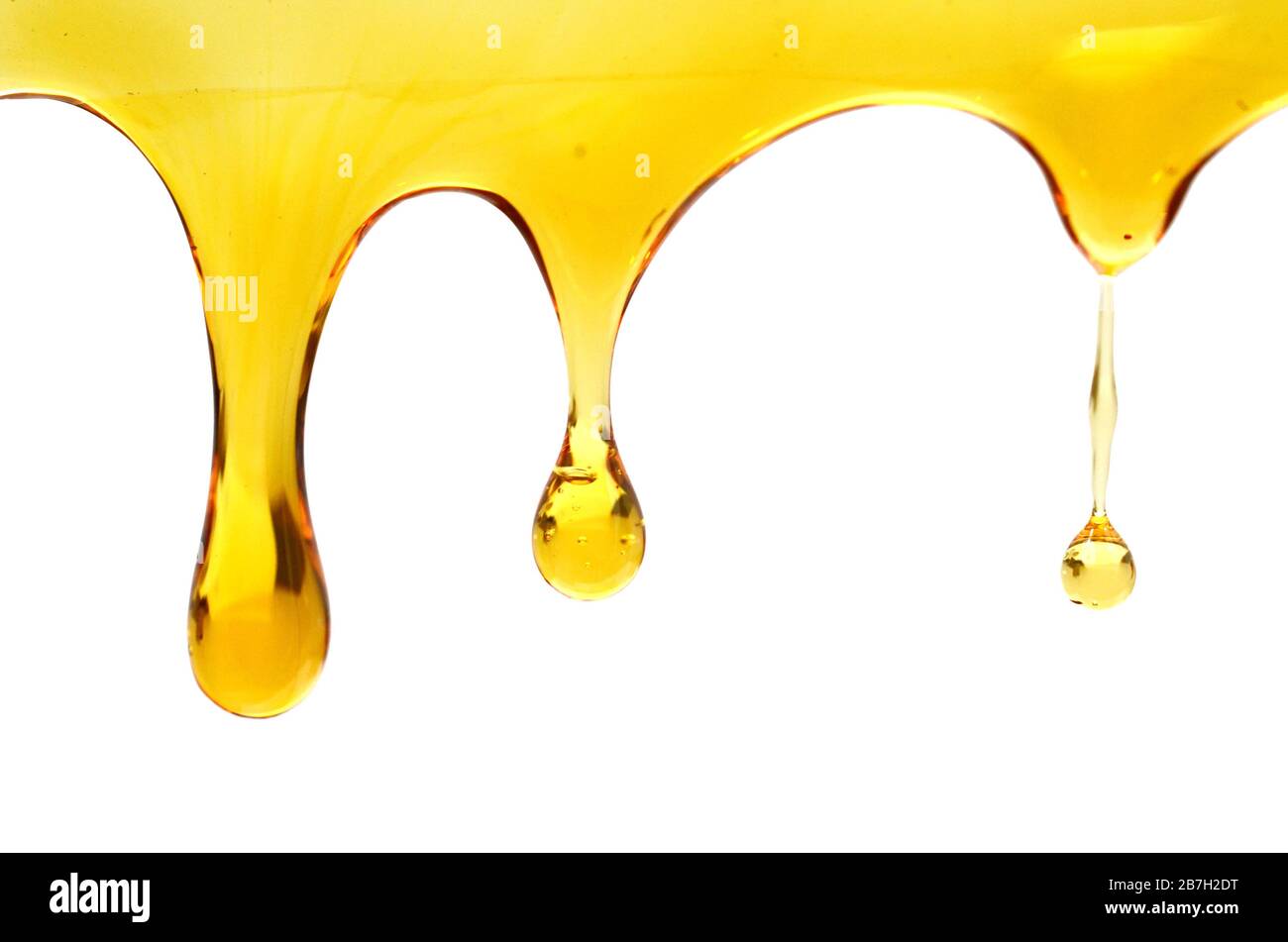 Flow down honey isolated on white Stock Photo - Alamy