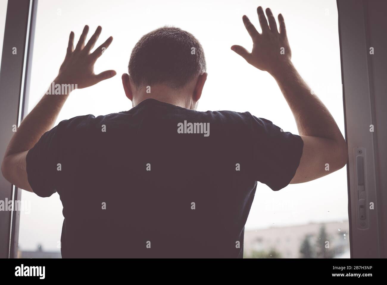 portrait one sad man standing near a window at the day Stock Photo - Alamy