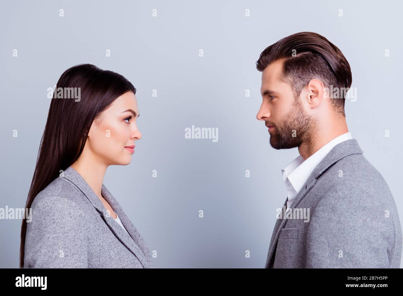 Concept of confrontation in business. Close up photo of two young ...