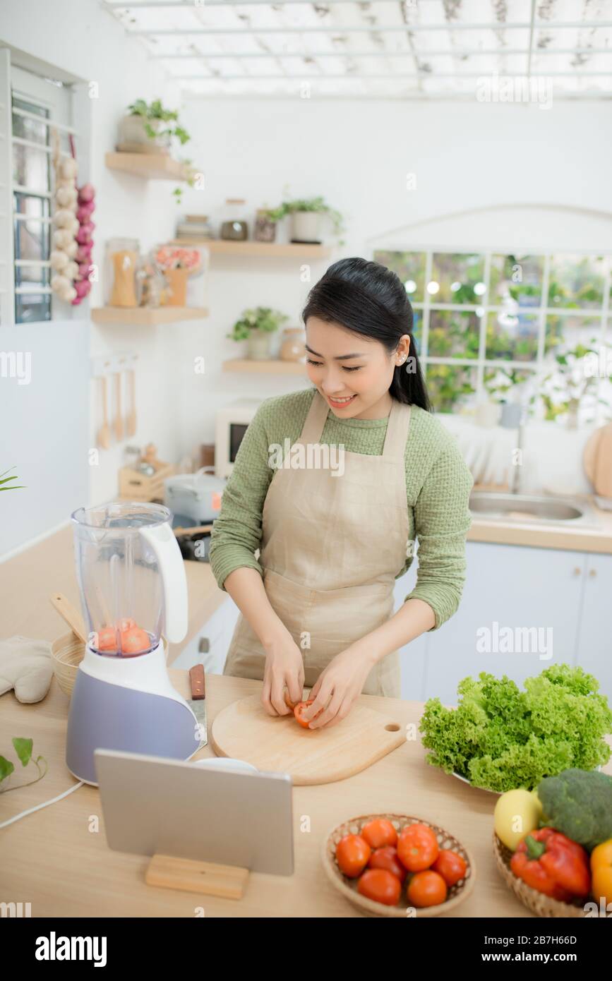 Lady cooking in kitchen hi-res stock photography and images - Alamy
