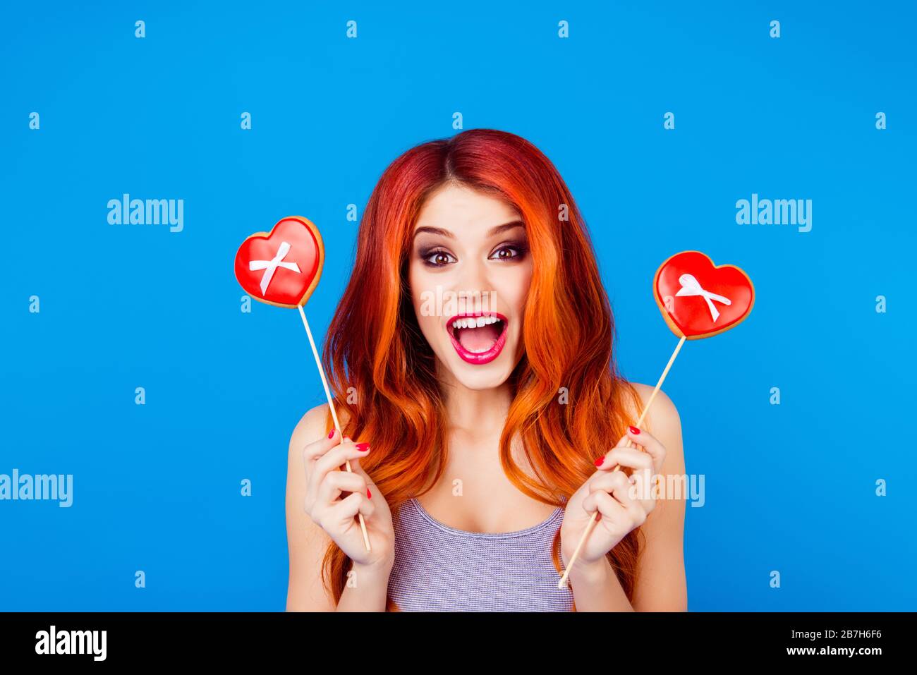 Portrait Of Stylish Funny Happy Carefree Girl With Ginger Hair Holding