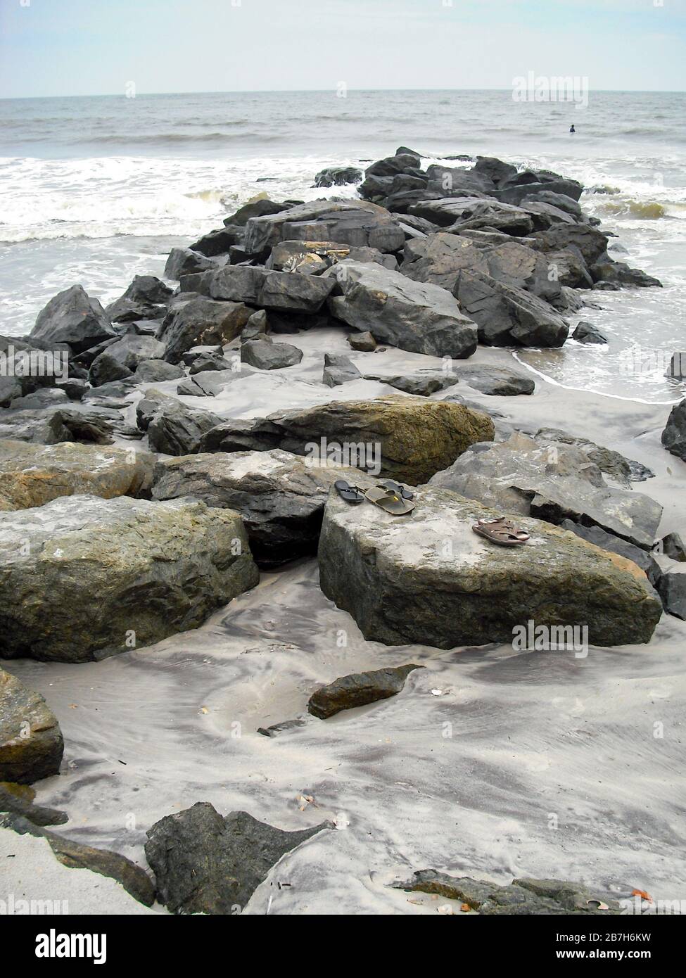 View at the stones from seashore Stock Photo - Alamy