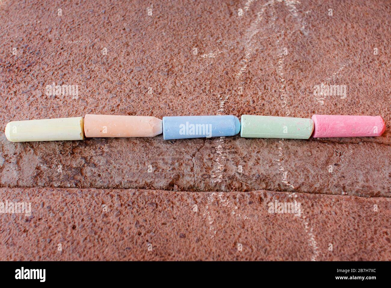 Rainbow Sidewalk Chalk and Marks on the Ground Stock Photo - Alamy
