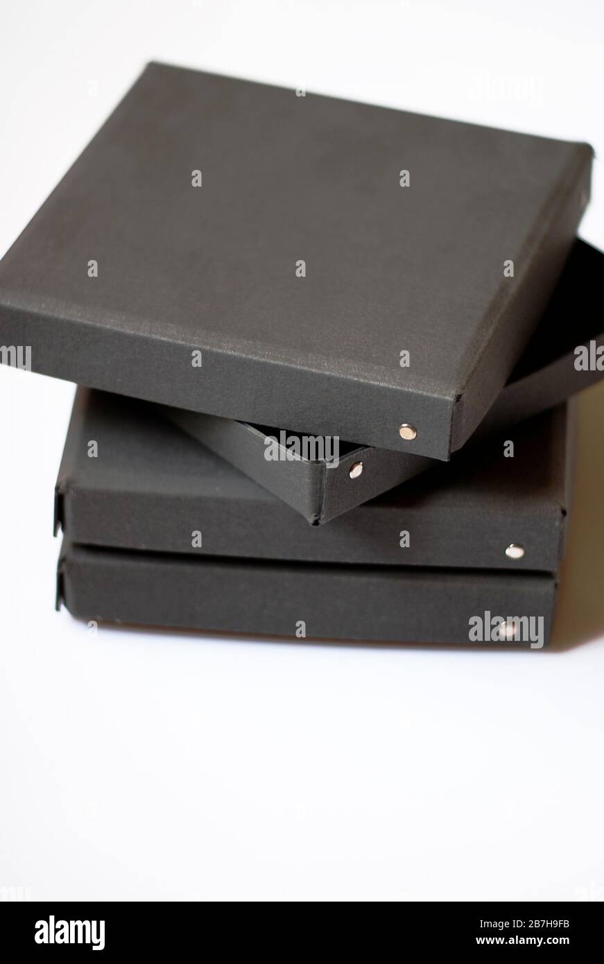 Grey archive cardboard boxes vertical close up Stock Photo - Alamy