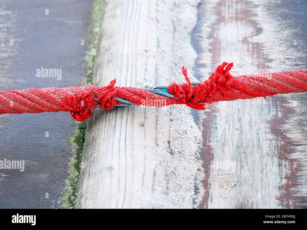 Red rope risk Stock Photo - Alamy