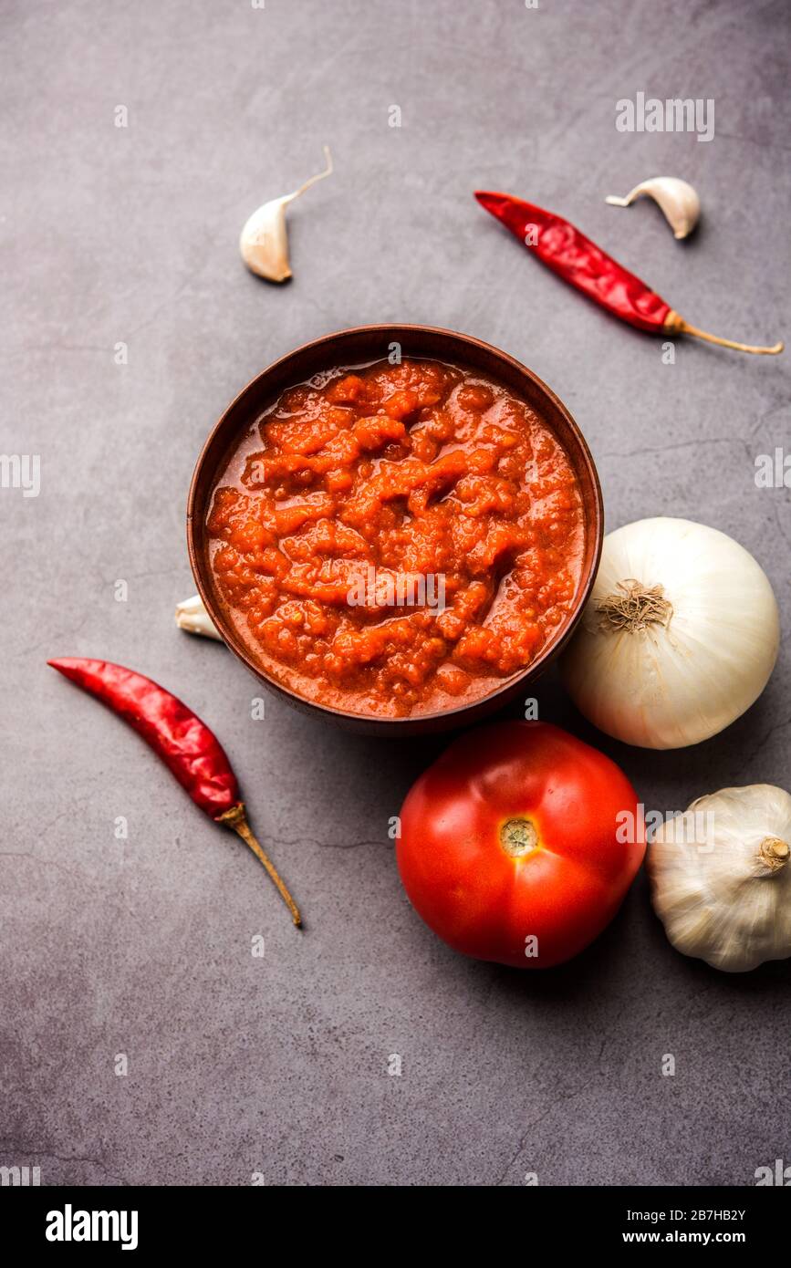 onion tomato masala or puree for indian gravy, served in a bowl with ...
