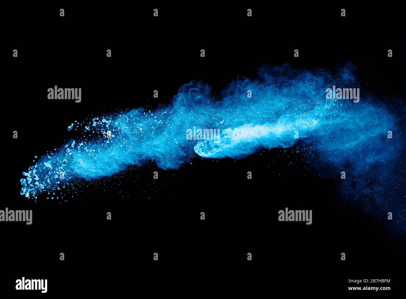 Blue dust explosion on black background. Freeze motion of color powder ...