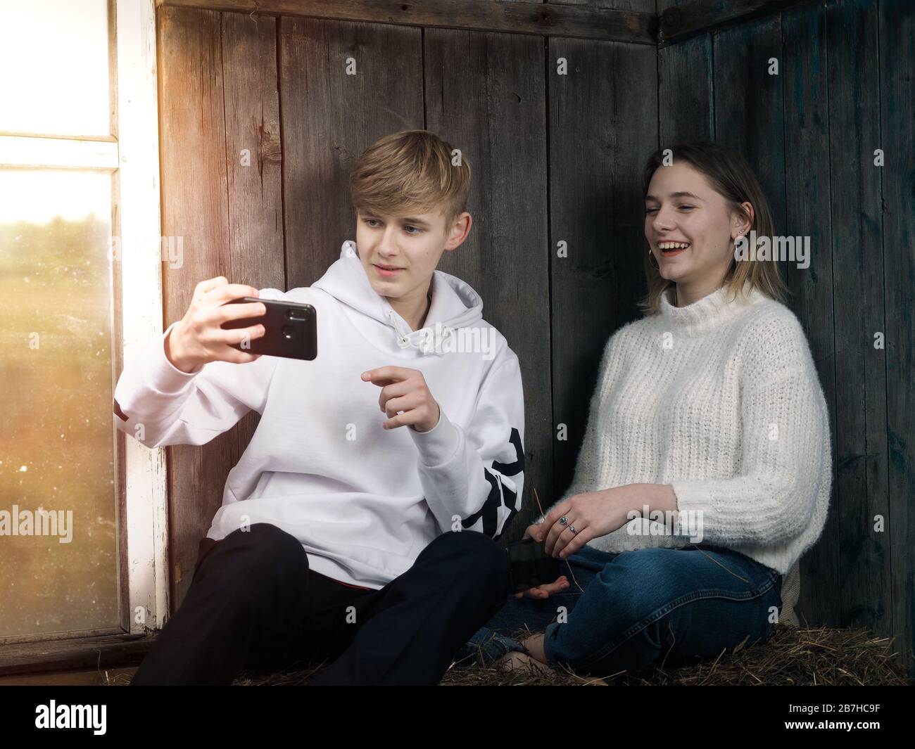 Teenagers are photographed with a smartphone camera Stock Photo - Alamy