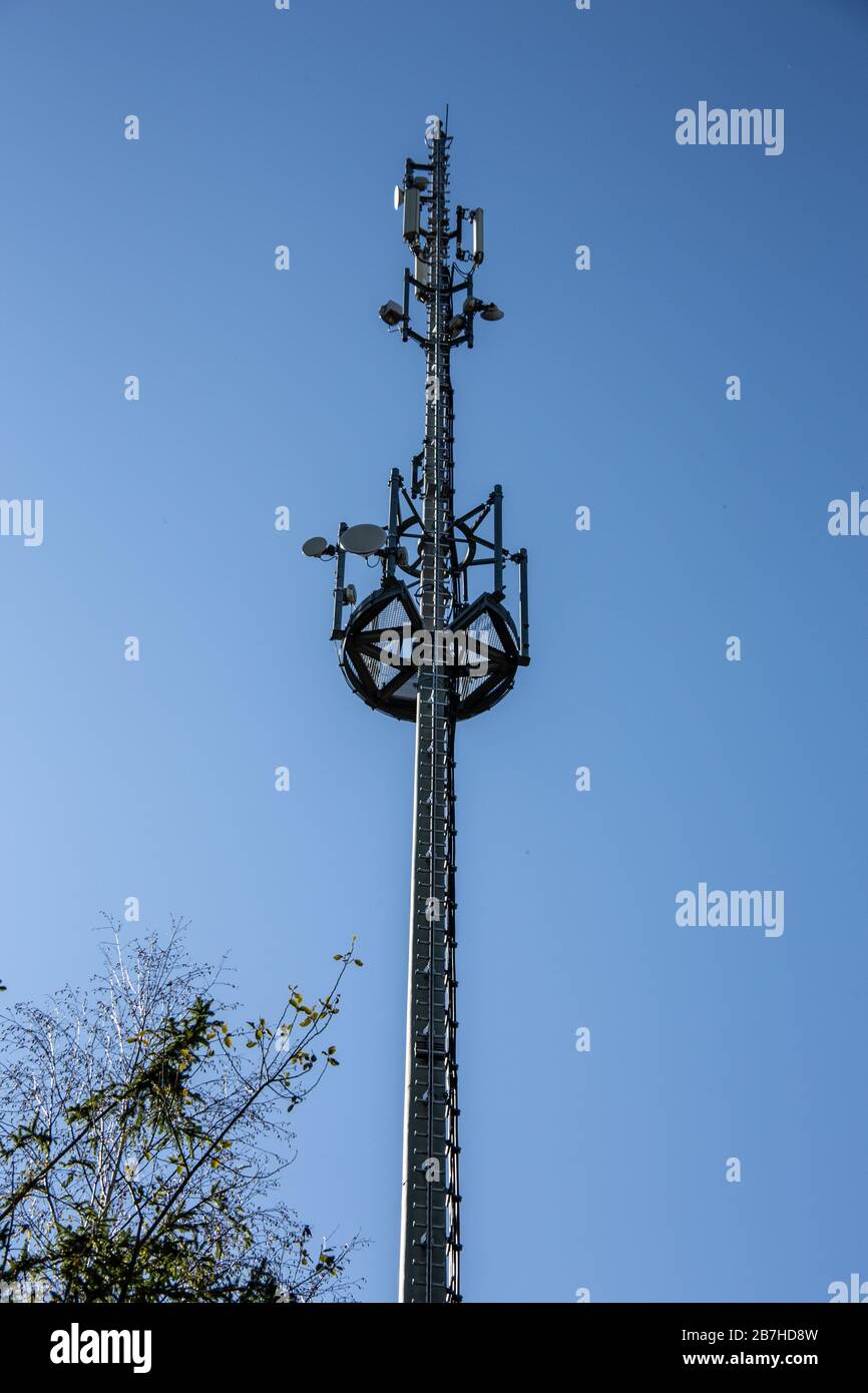 high slim transmission tower for mobile radio Stock Photo - Alamy