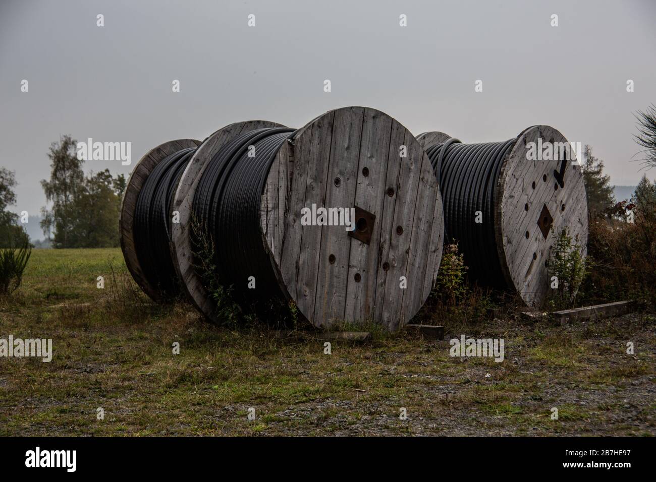 large heavy cable drums with insulated copper cables Stock Photo - Alamy