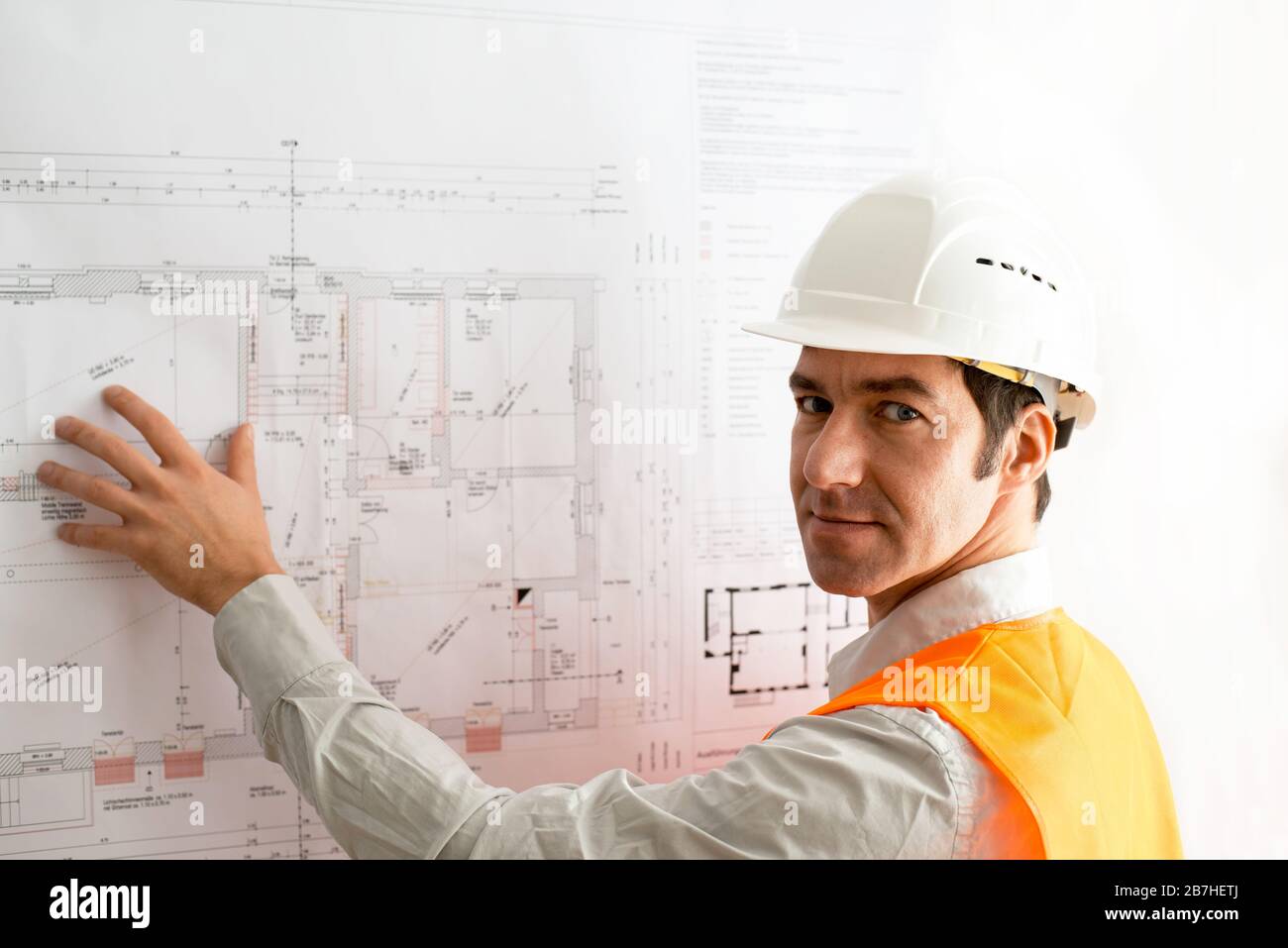 architect planning a house on the ground plan Stock Photo - Alamy