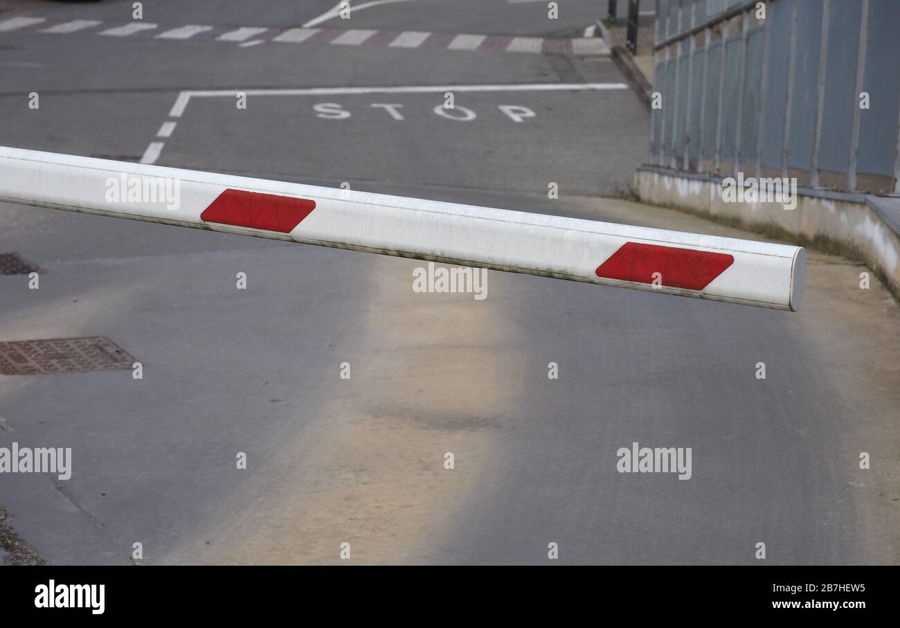red and white car parking bar and stop sign Stock Photo - Alamy