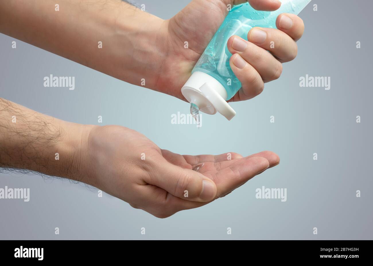 Person applying hand sanitiser gel, killing bacteria and disease ...