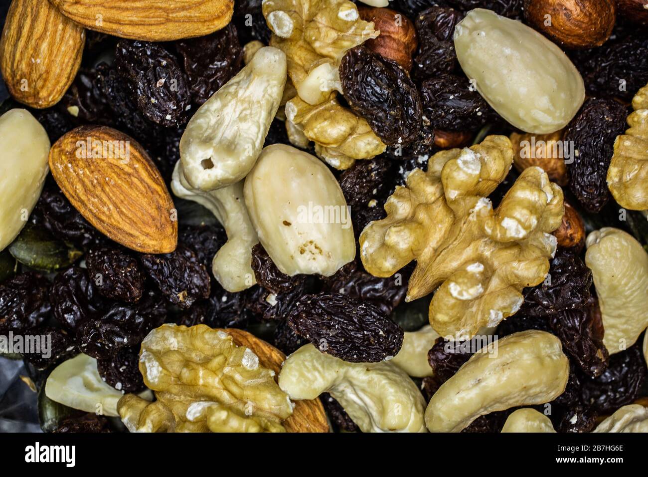 Nut mix and raisins as student food Stock Photo - Alamy
