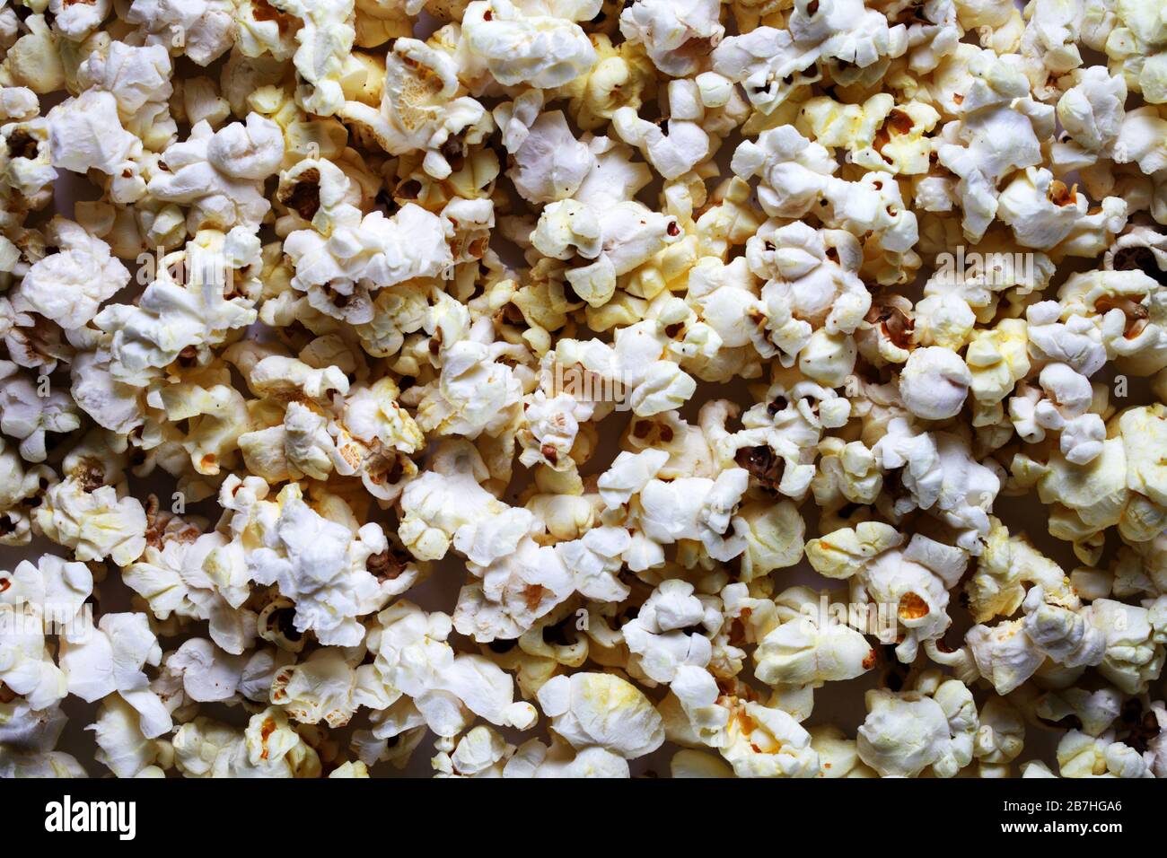 popcorn on a white background macro background texture Stock Photo - Alamy