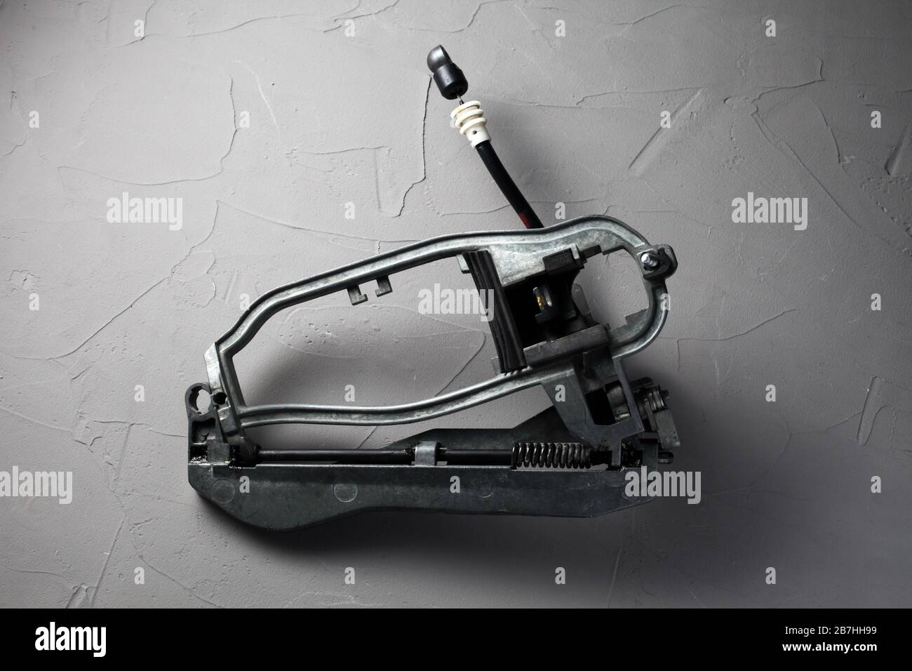 car handle mechanism on concrete background Stock Photo - Alamy