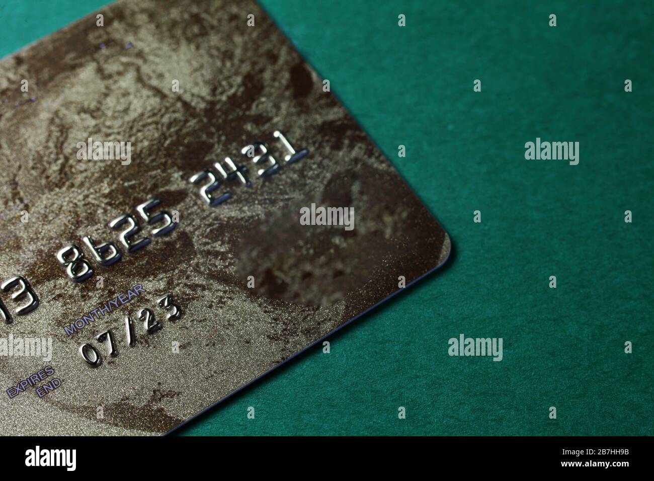 Bank card on a green background Stock Photo - Alamy