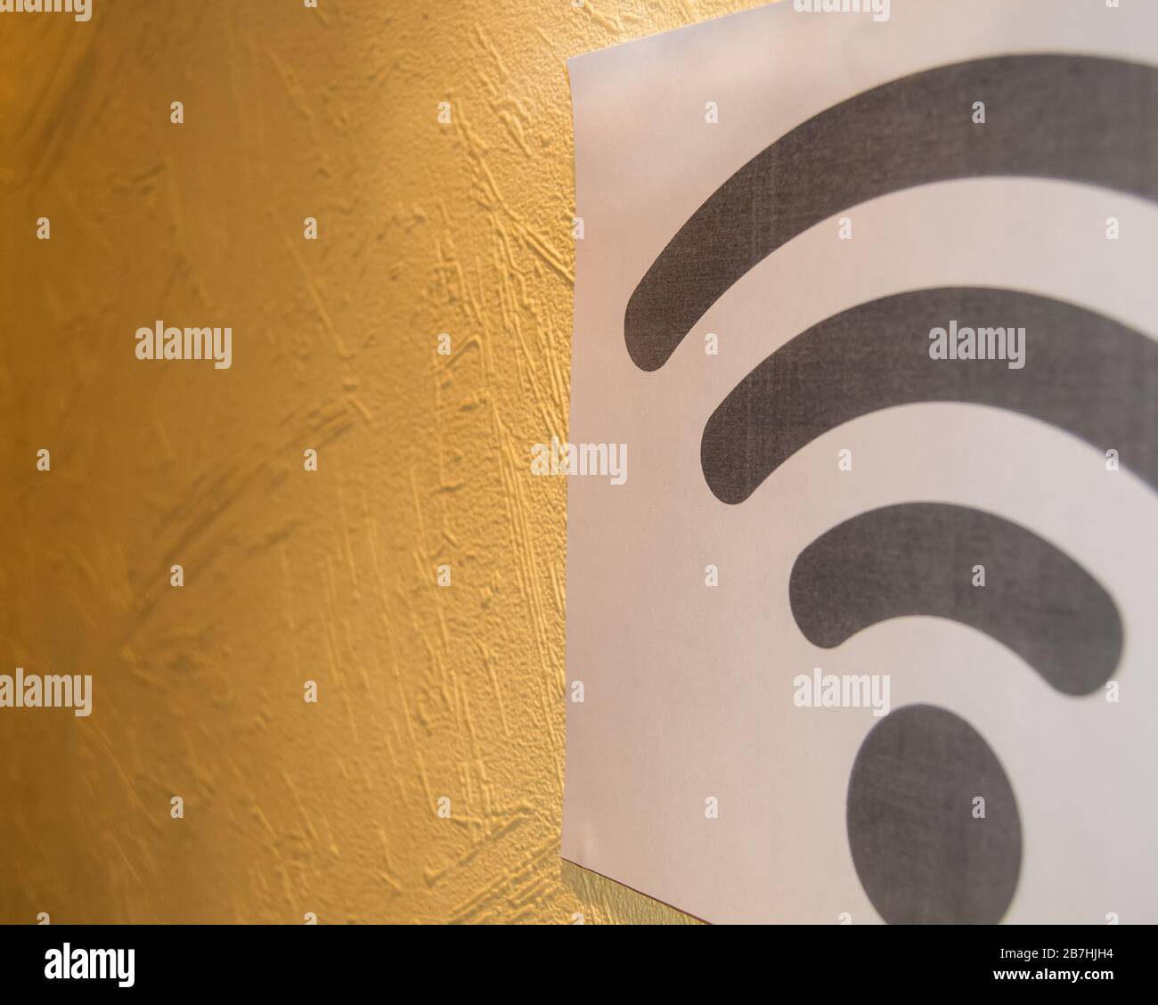 Wireless zone concept. WiFi symbol on the wall with a copy of the space ...