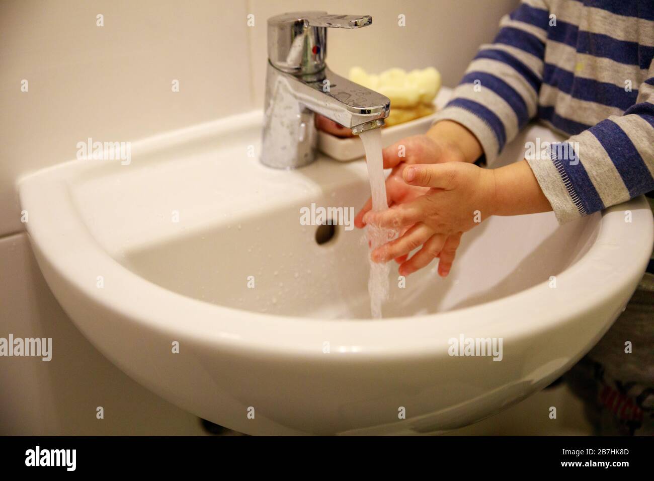 hands of a child during handwashing Stock Photo - Alamy