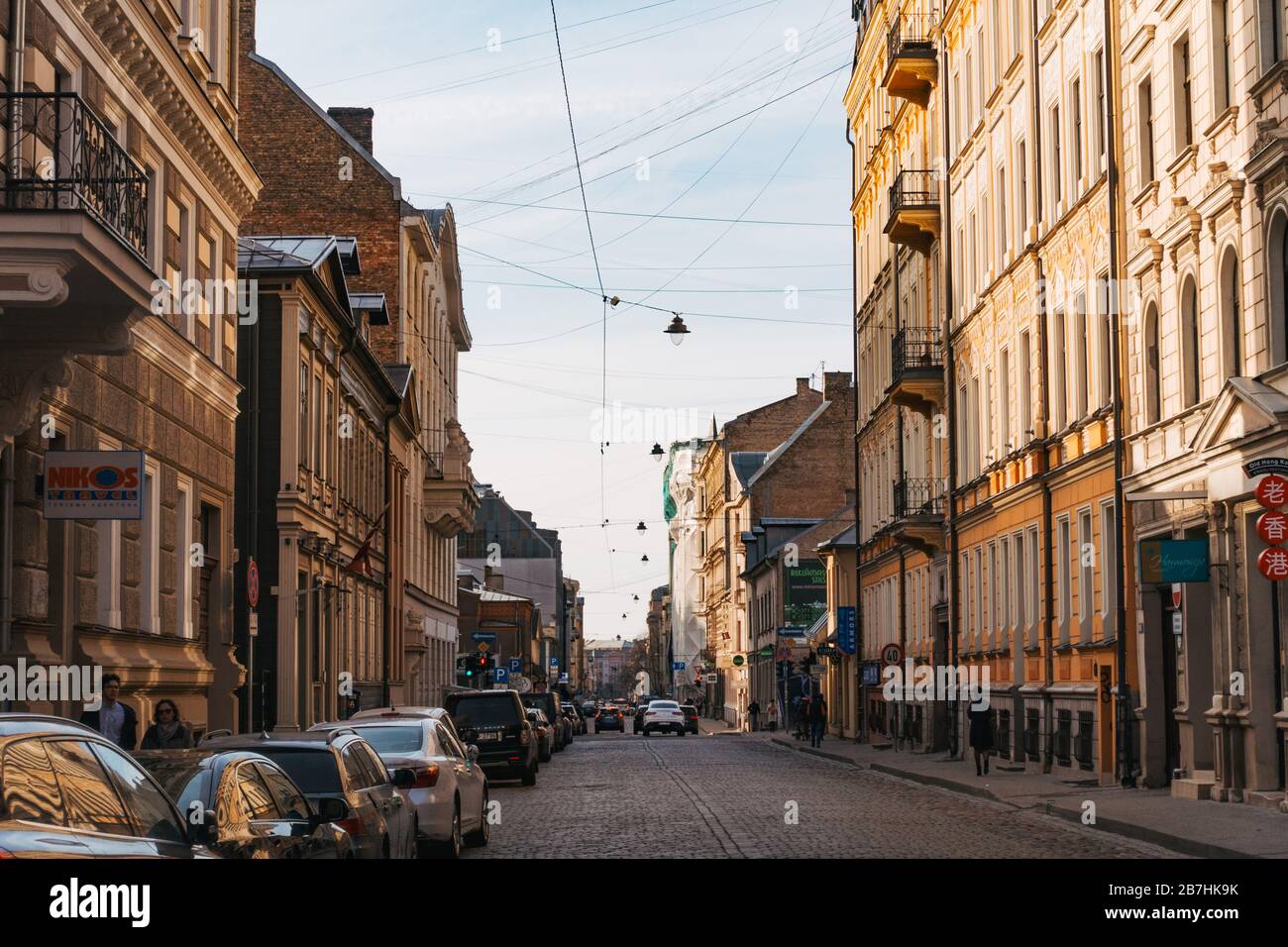 Historic buildings line central city streets in Riga, Latvia on a sunny ...