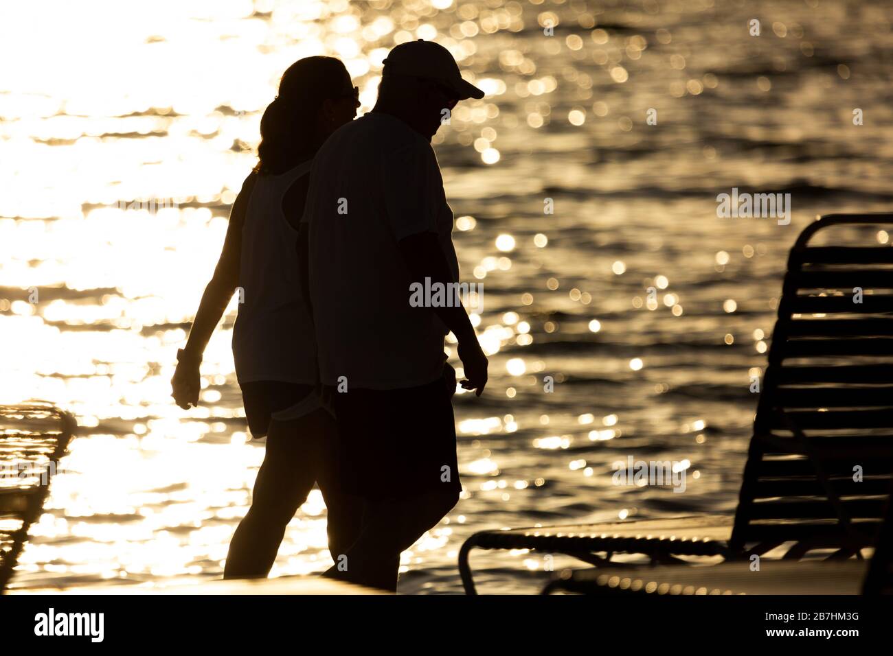 People walk along Lido Beach on Lido Key in Sarasota Florida just ...