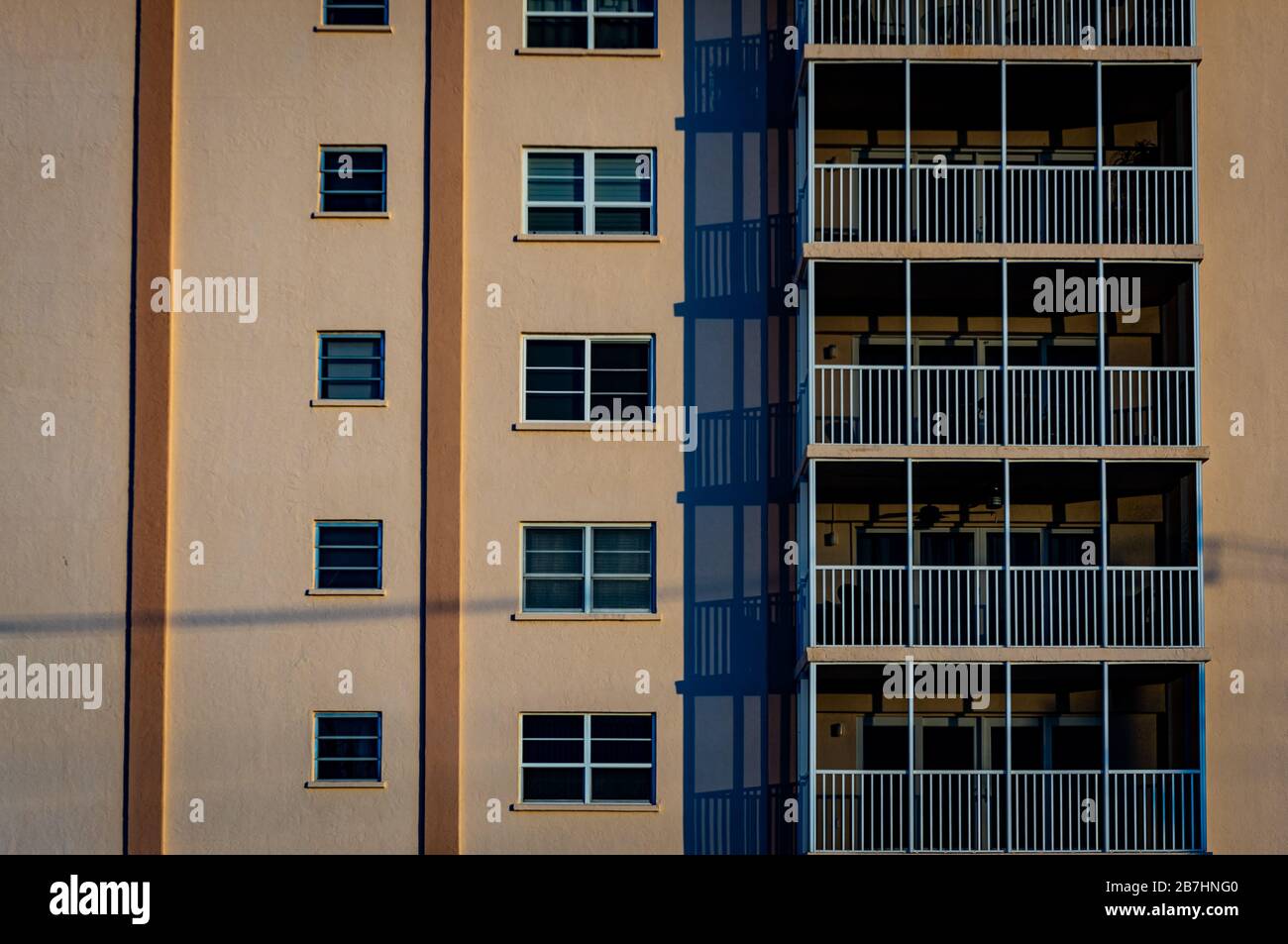 repeating patterns of windows and screened off porches on a hotel on ...