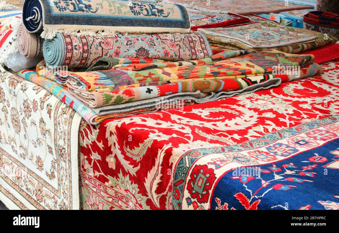 market stall with many precious oriental rugs Stock Photo - Alamy