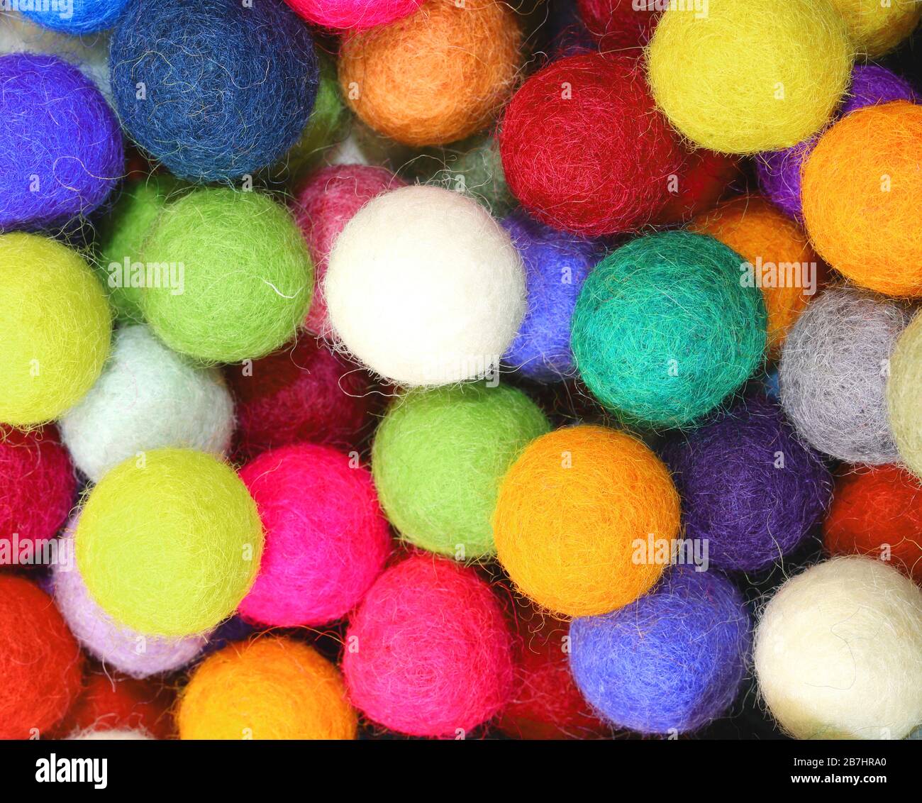 colorful balls made of felt for the decorations of the house on special ...