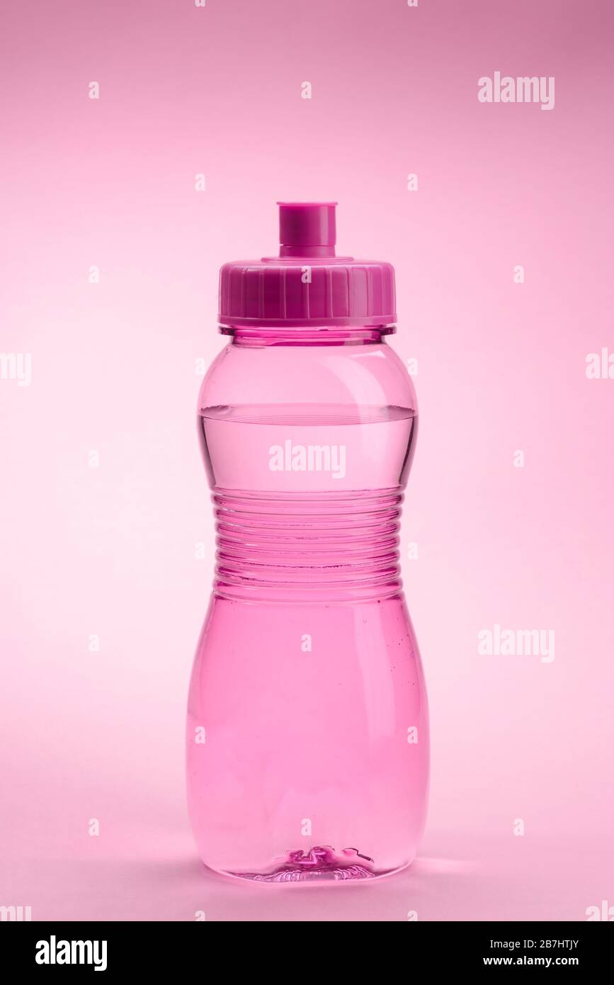 Plastic bottle of water on pink background Stock Photo - Alamy