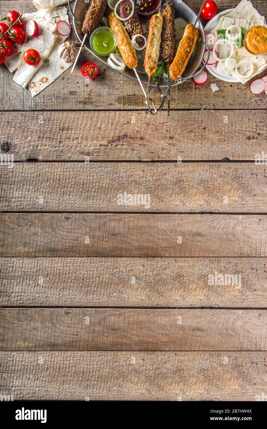 Summer bbq party. Shish kebab on a stick, from ground beef and chicken ...