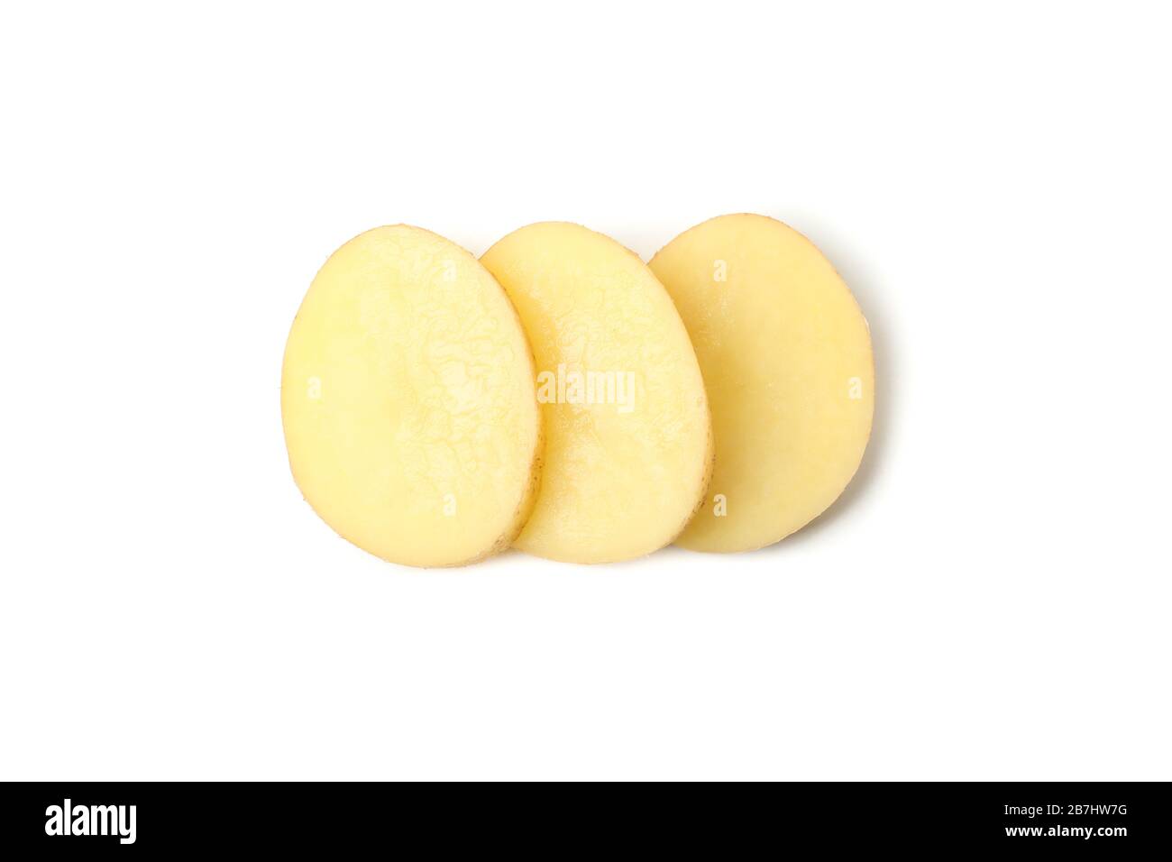 Young potato slices isolated on white background Stock Photo - Alamy