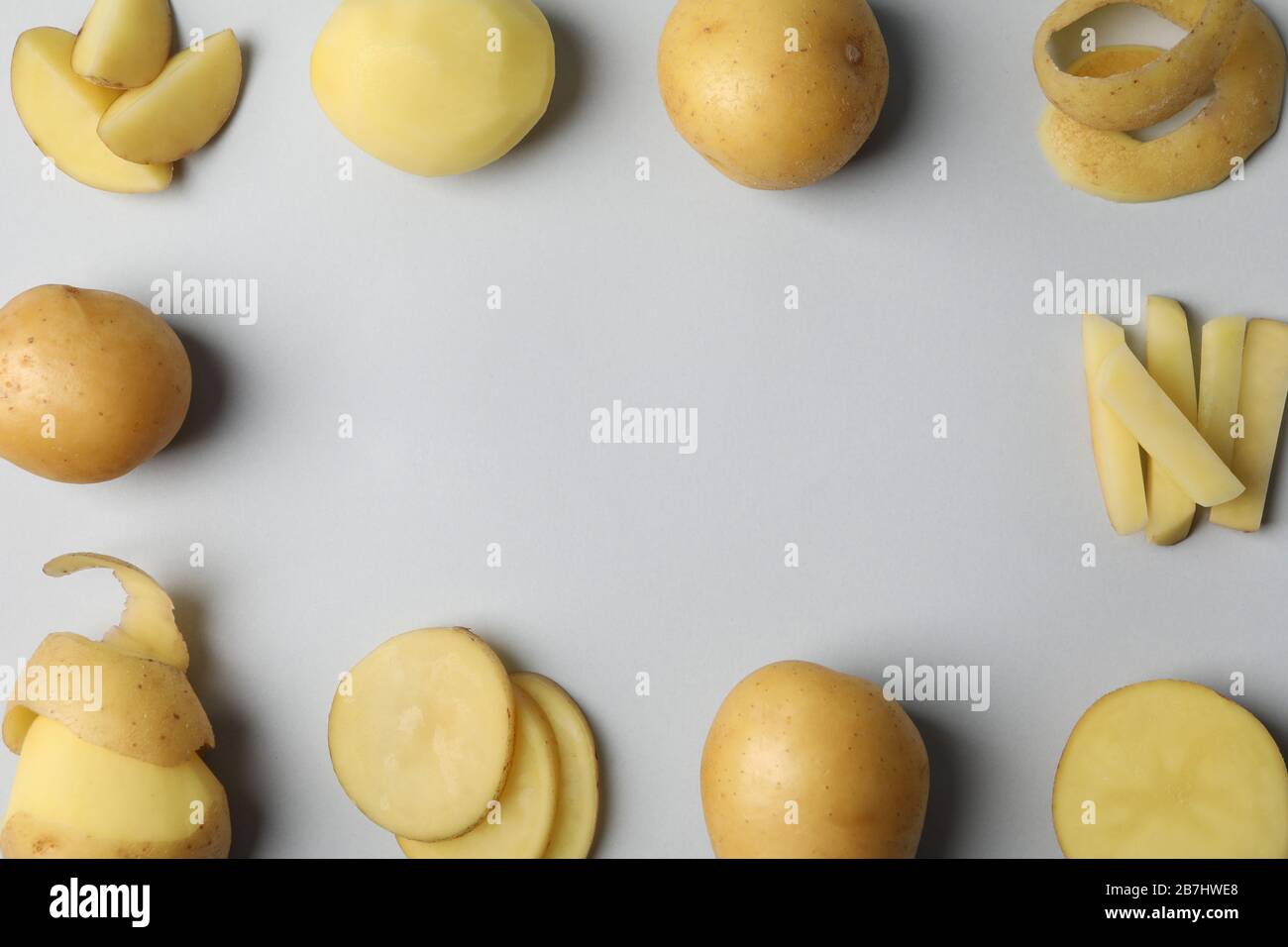 Young potato on grey background, top view and space for text Stock ...