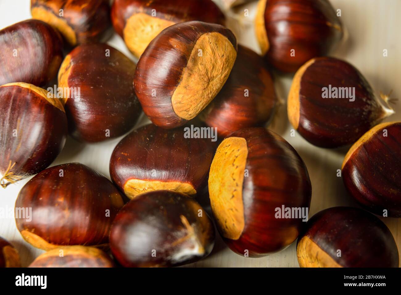 chestnuts on a white cutting board Stock Photo - Alamy