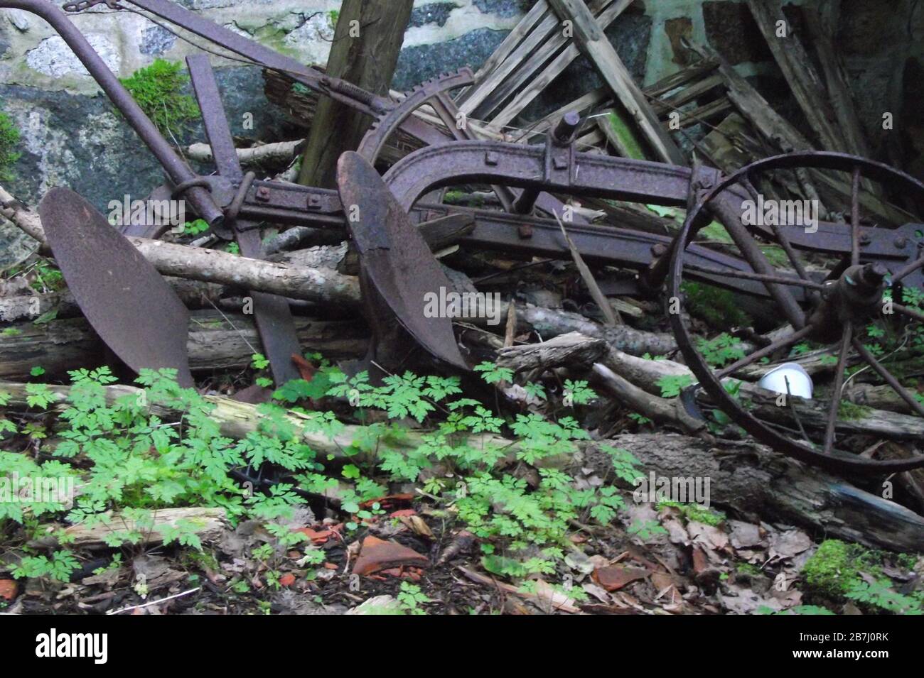 Plough laying in old deserted farmhouse Stock Photo - Alamy