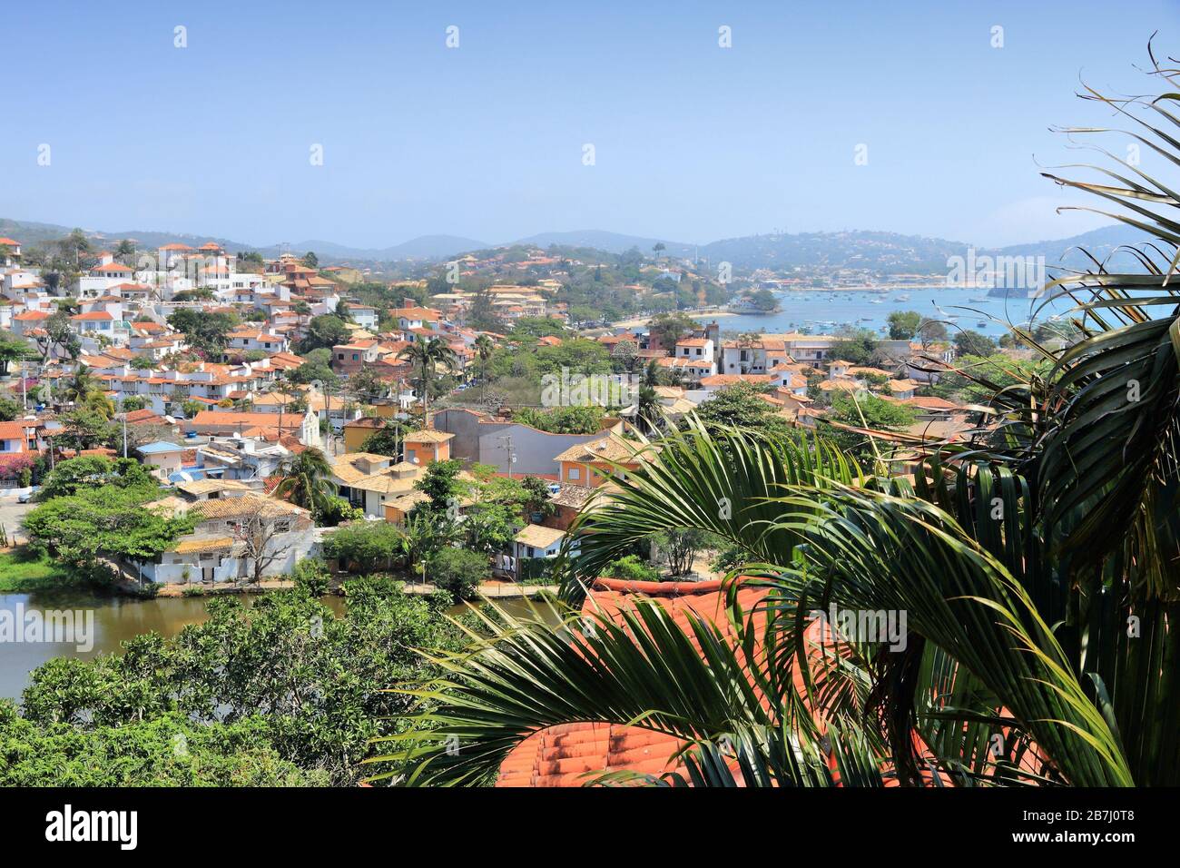 Buzios, vacation town in Brazil. Townscape with palm tree Stock Photo ...