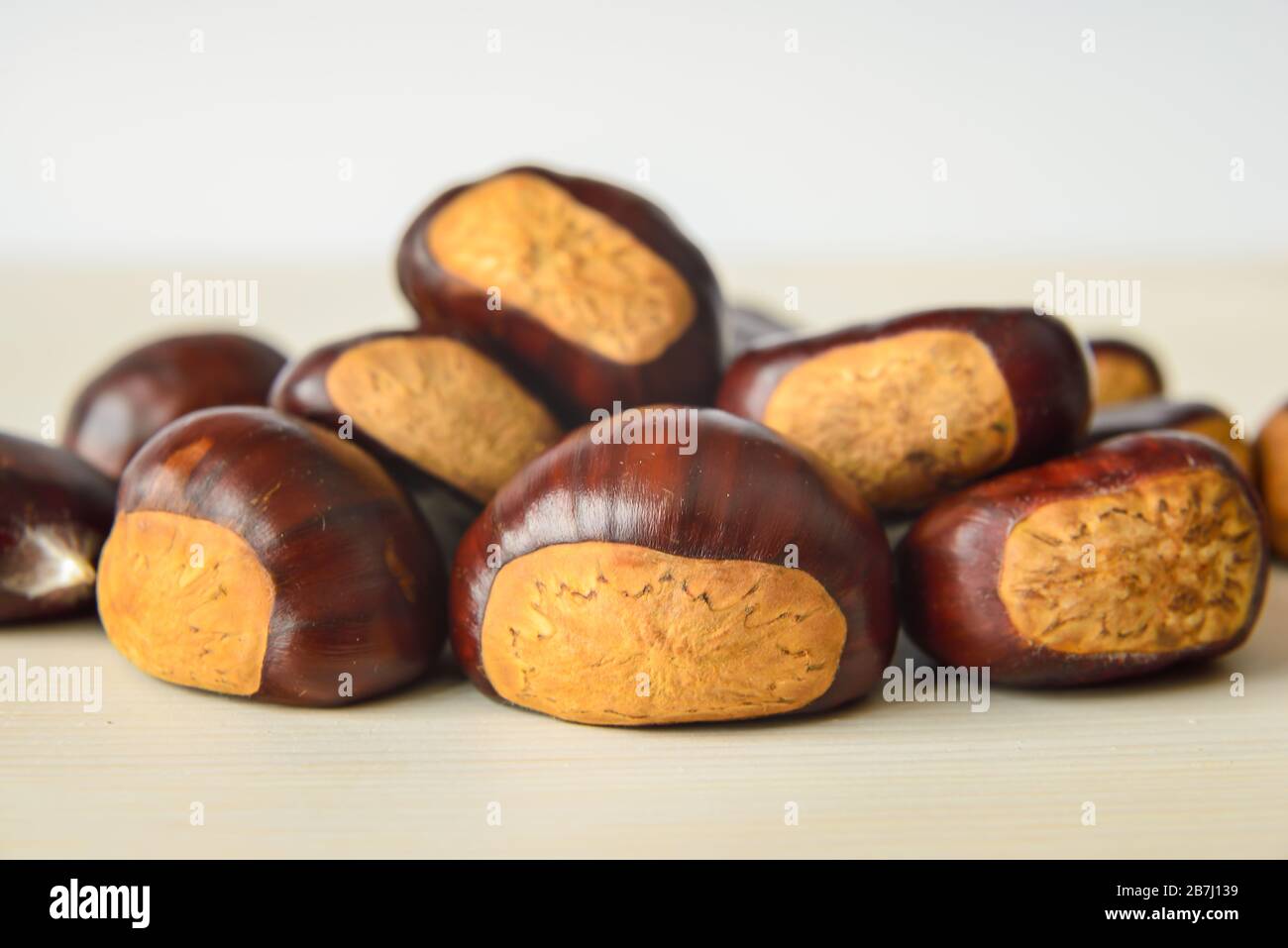 chestnuts on a white cutting board Stock Photo - Alamy