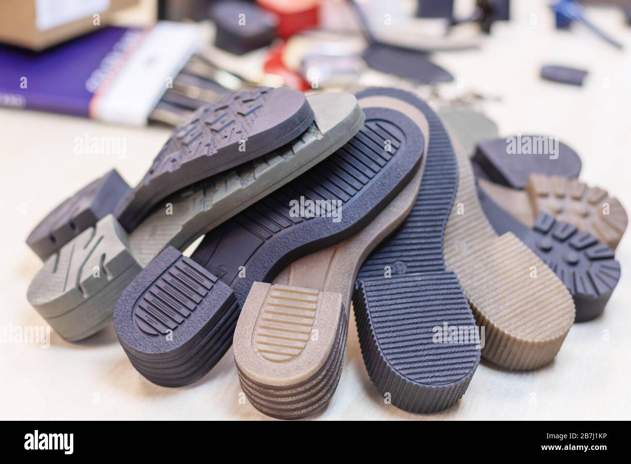 Variety of shoes. Different shoe sole on a grey background Stock Photo ...