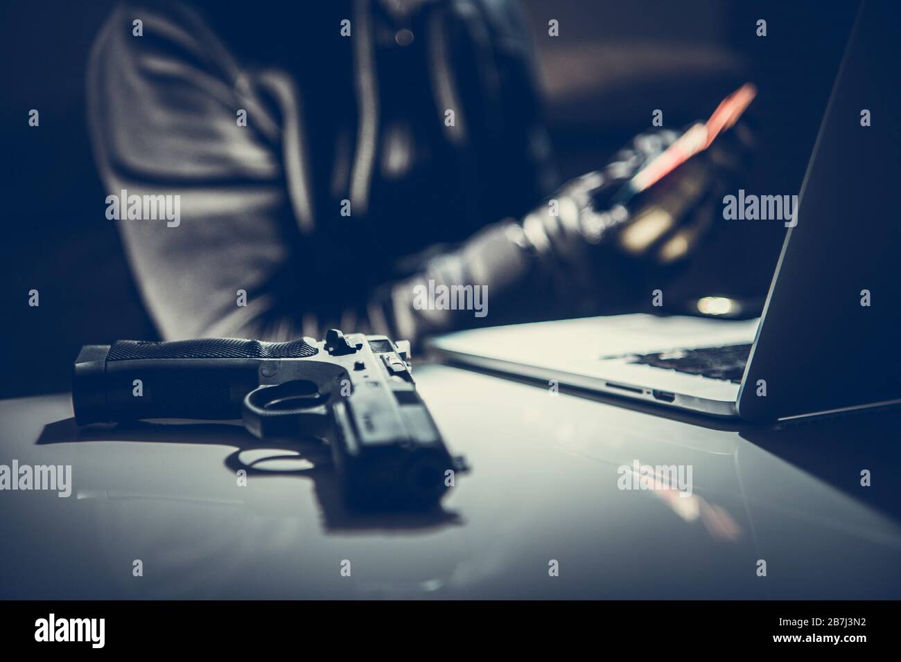 Online Hacking Gang . Handgun and Laptop on Desk. Cybercrime Concept ...