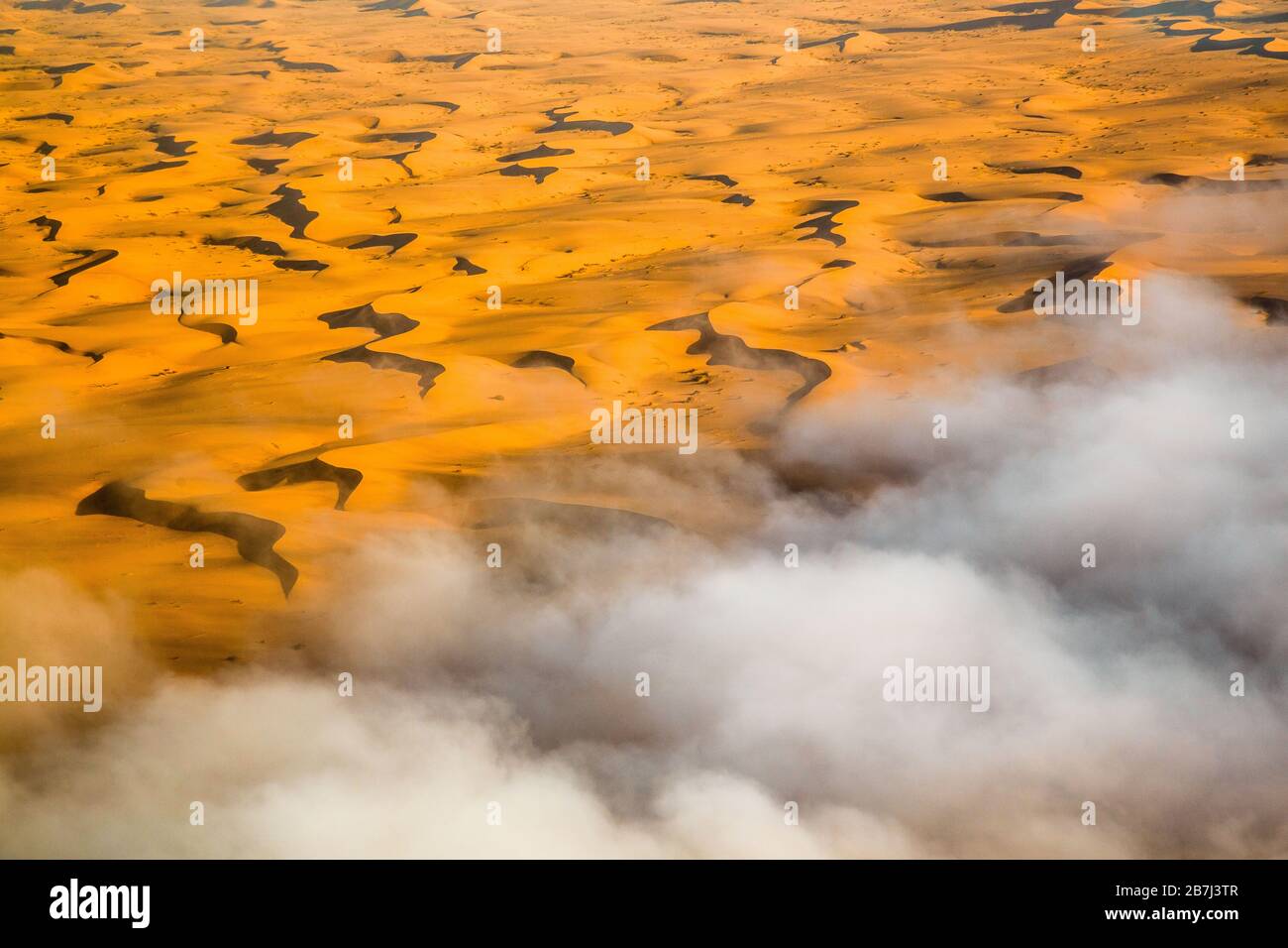 Sand dunes of Namib desert from aircraft on Skeleton coast in Namibia ...
