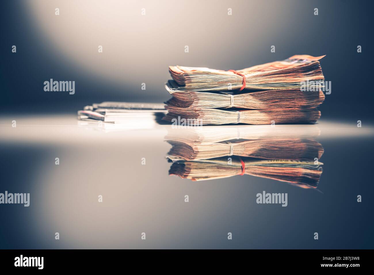 Small Pile of Cash Money on Glassy Table Top. Business and Economy ...