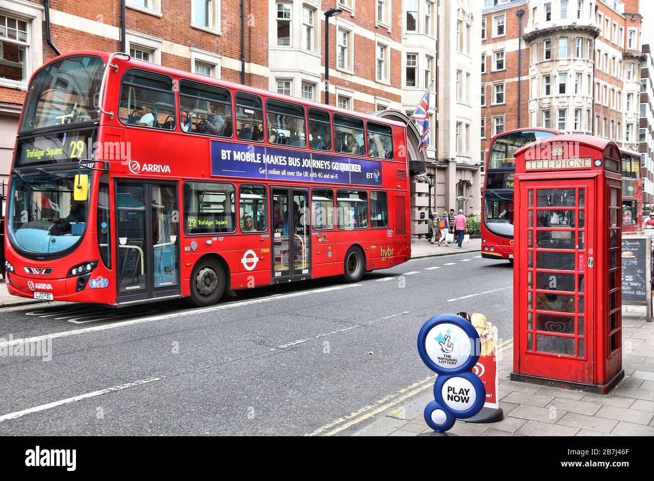 LONDON, UK - JULY 9, 2016: People ride a double decker bus at ...