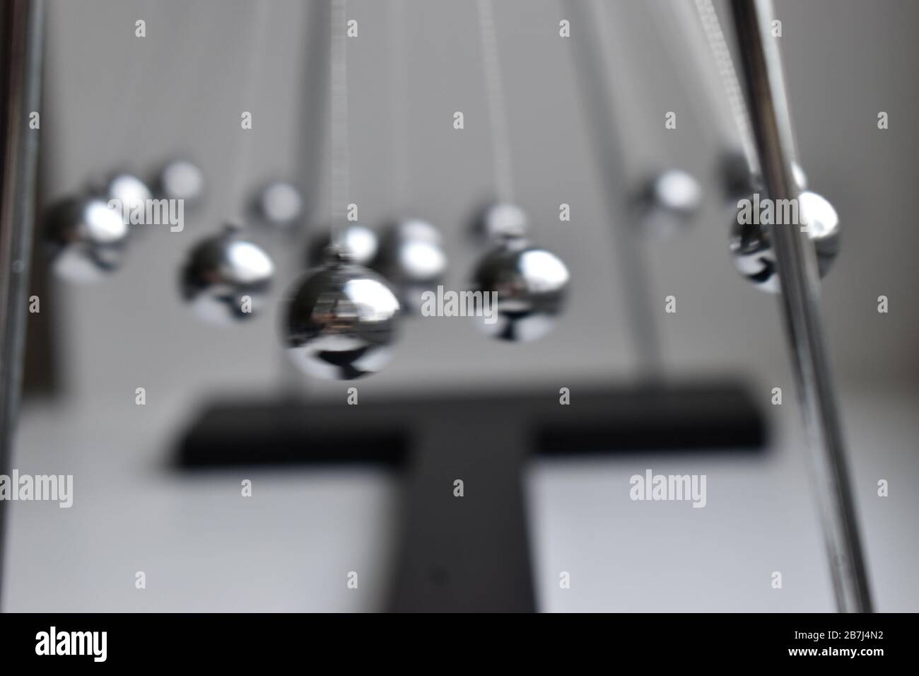 Business concept for strategy team work and alignment. Newtons Cradle ...