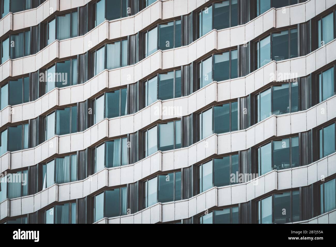 Irregular facade of an urban building creating a pattern Stock Photo ...