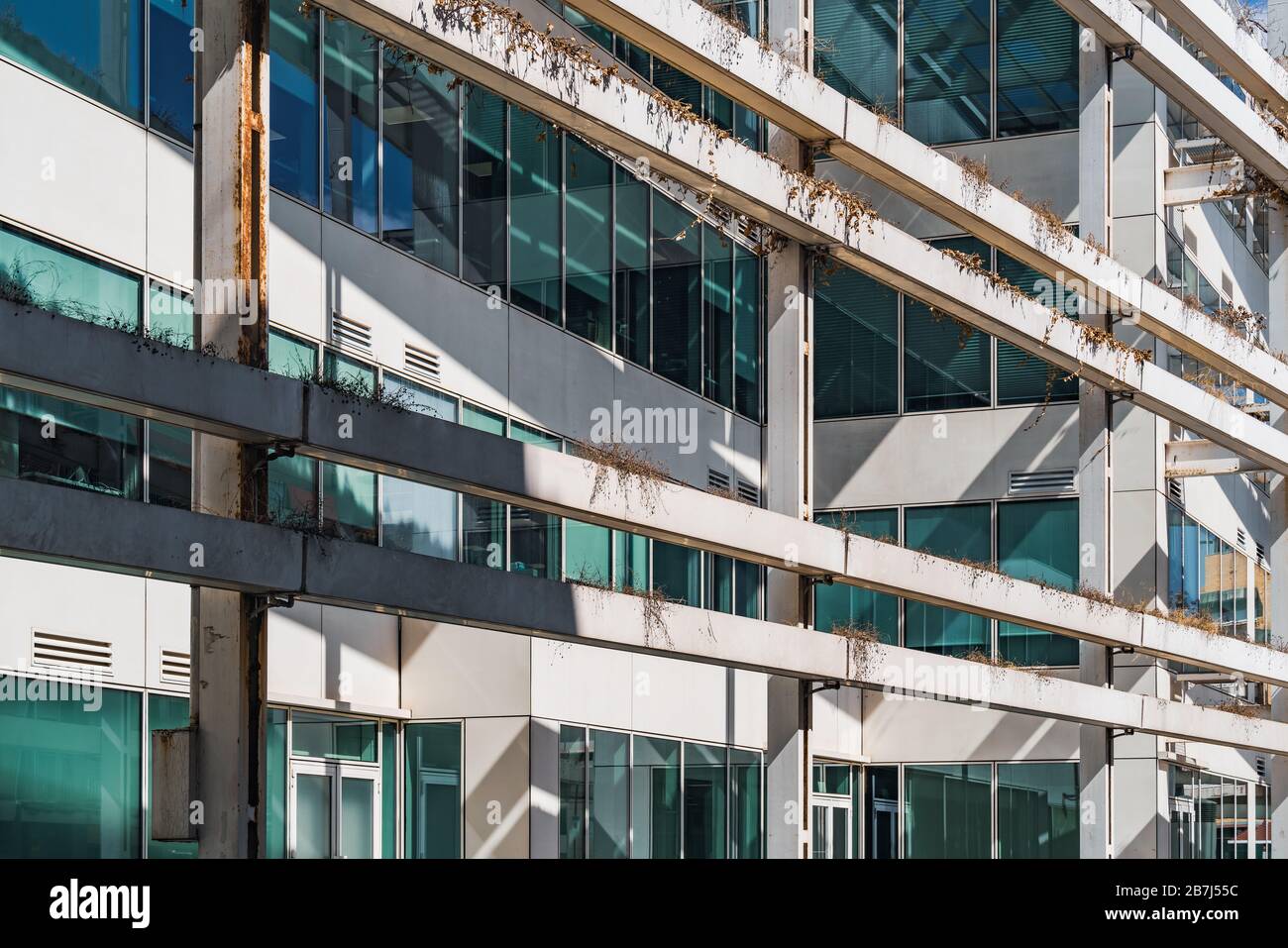 Blue windows and aluminum structures of the facade of an office ...